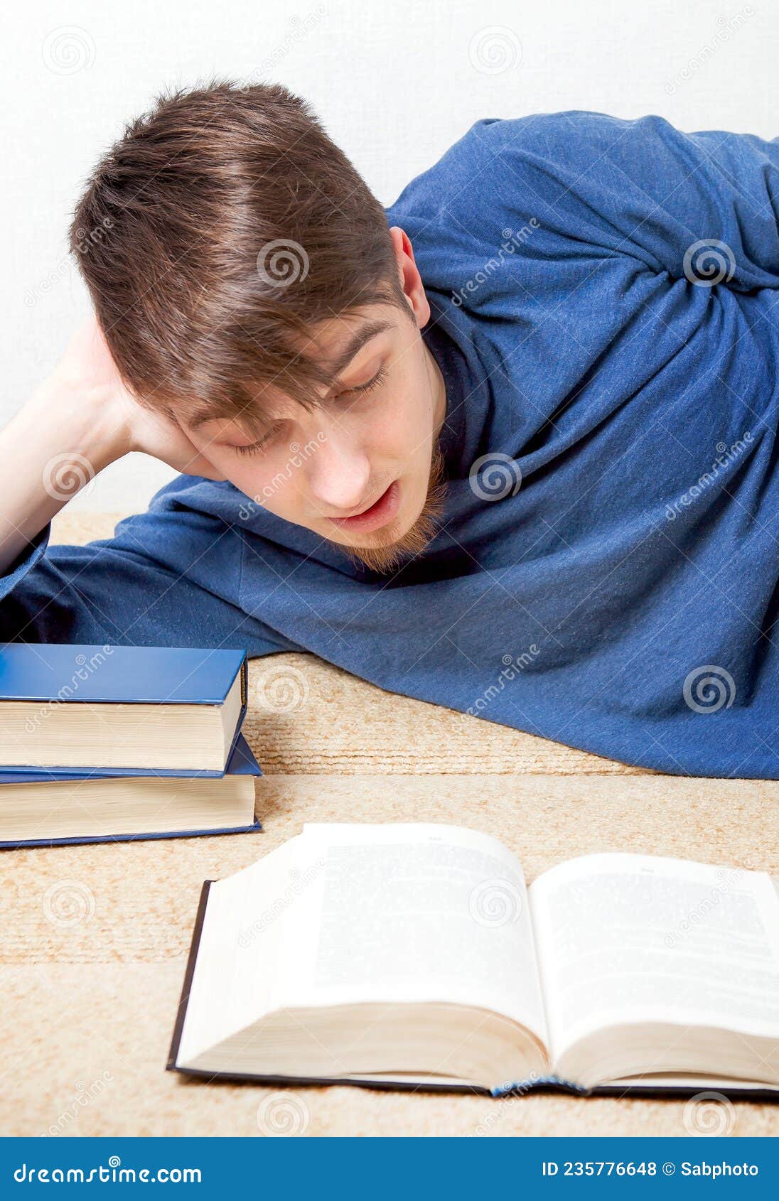 Young Man read a Book stock photo. Image of face, room - 235776648