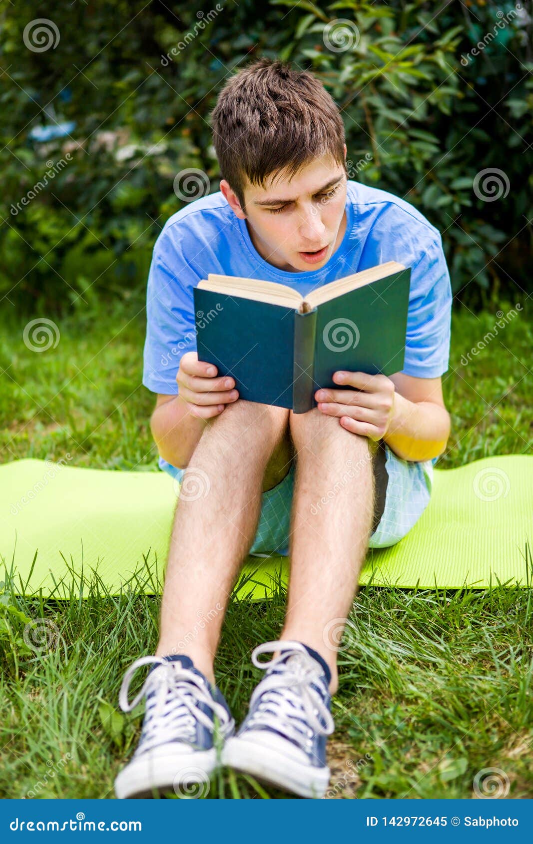 Young Man read a Book stock image. Image of casual, male - 142972645