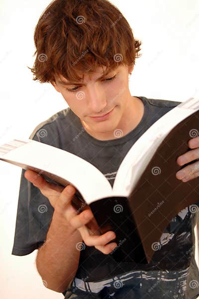 Young man reading big book stock image. Image of learn - 6723733