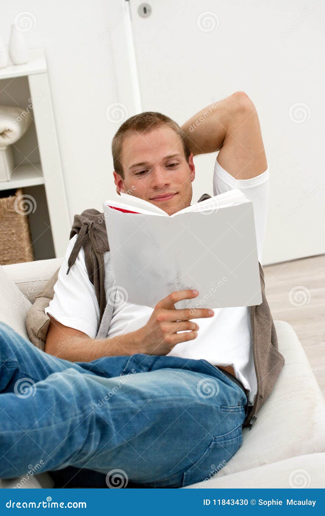 Young man reading a book stock photo. Image of chilling - 11843430