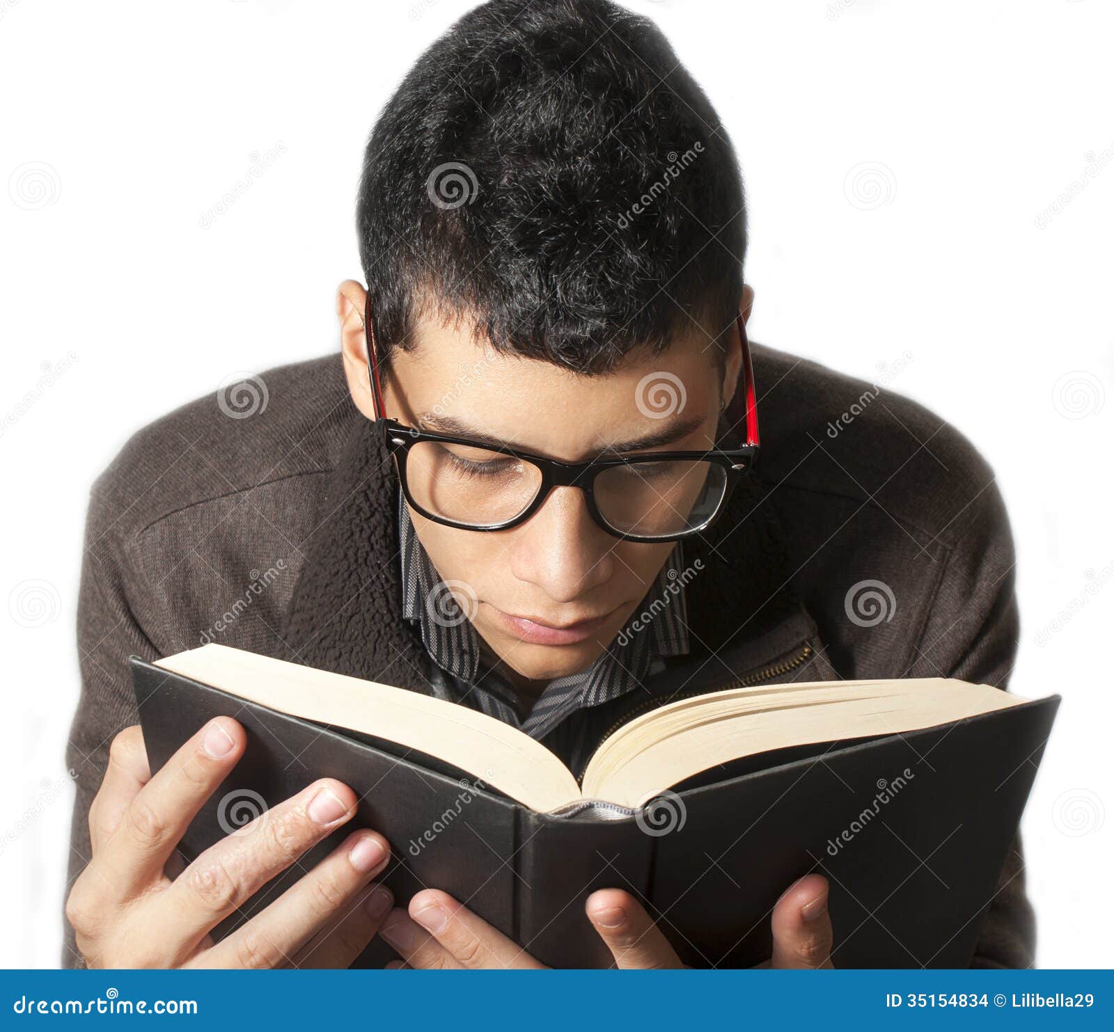 Young man reading a book stock photo. Image of adult - 35154834