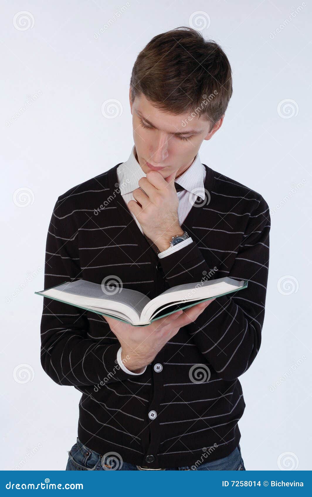 Young man reading a book stock photo. Image of student - 7258014
