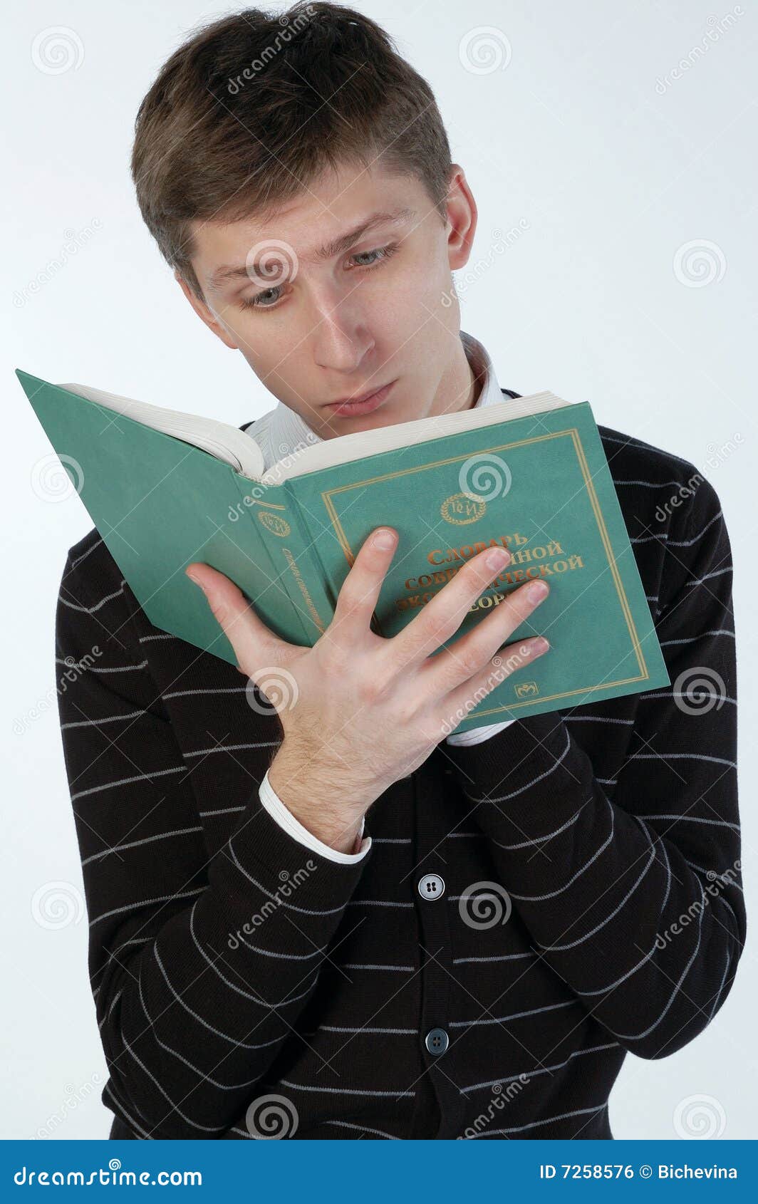 Young man reading a book stock photo. Image of study, attentive - 7258576