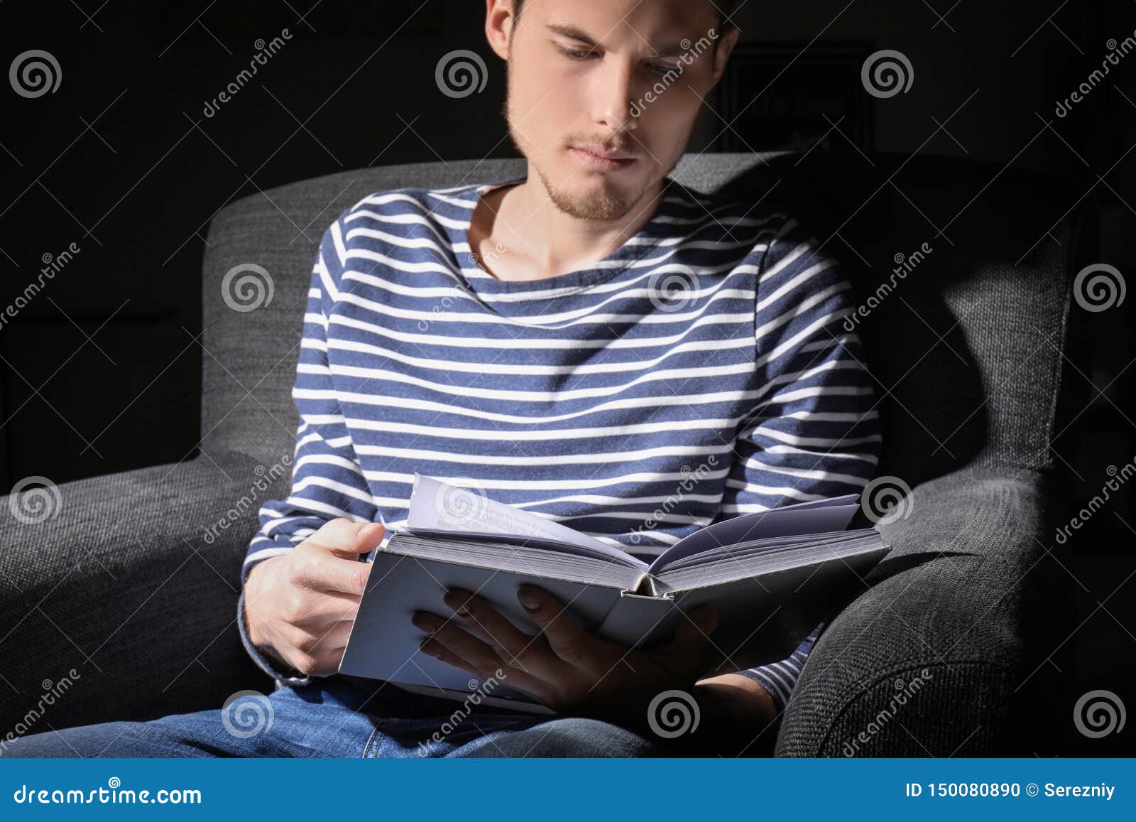Young Man Reading Book in Evening at Home Stock Photo - Image of learn ...
