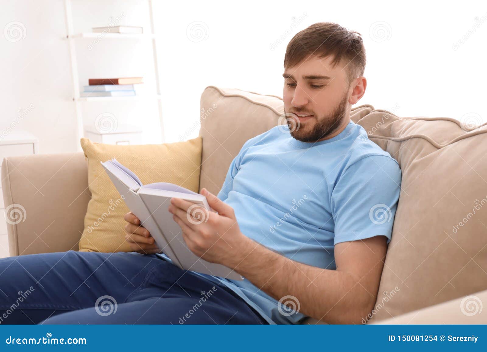Young Man Reading Book at Home Stock Photo - Image of information ...