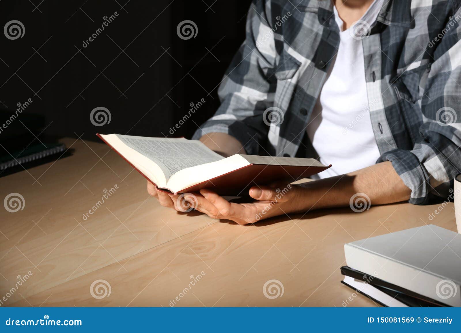 Young Man Reading Book Late in Evening Stock Image - Image of late ...
