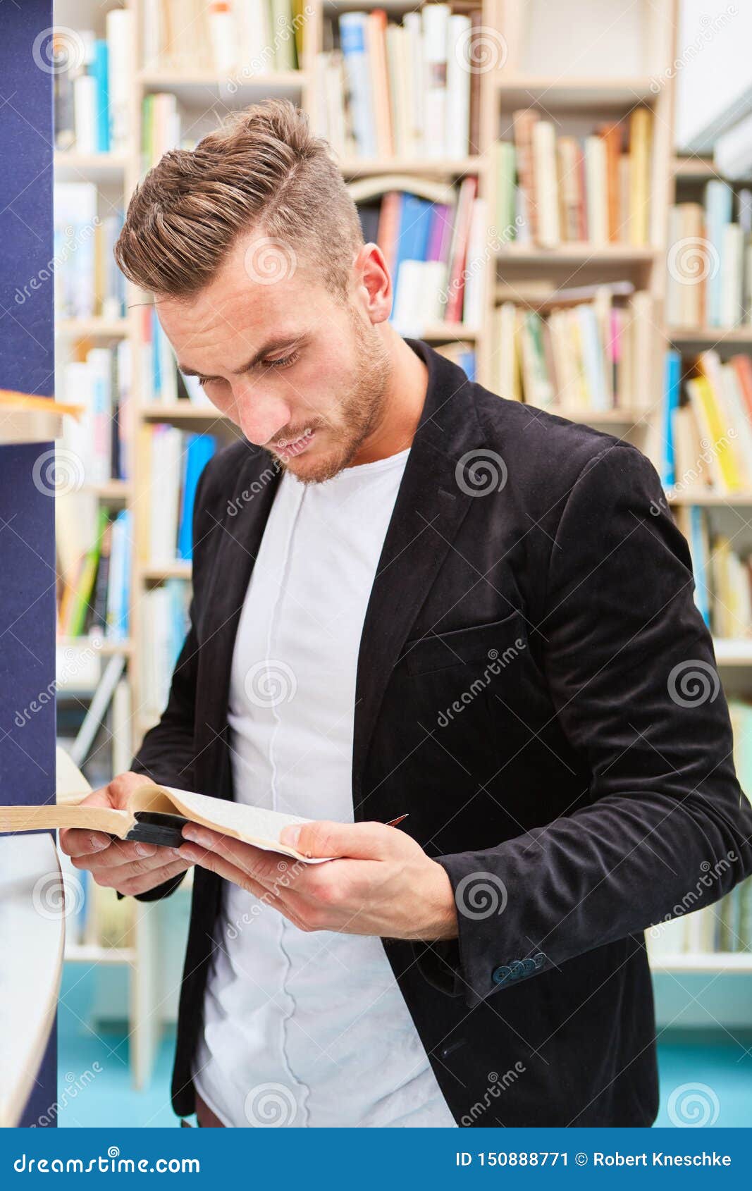 Young Man Reading The Book In The Library Stock Image - Image of shelf ...