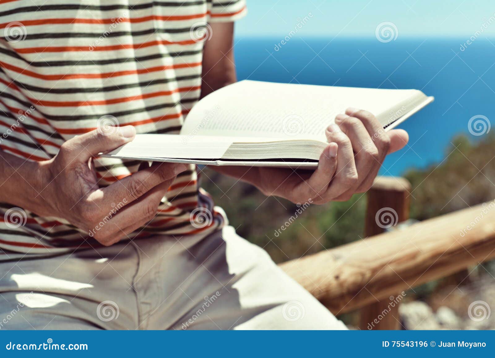 Young Man Reading a Book Outdoors Stock Photo - Image of novel ...