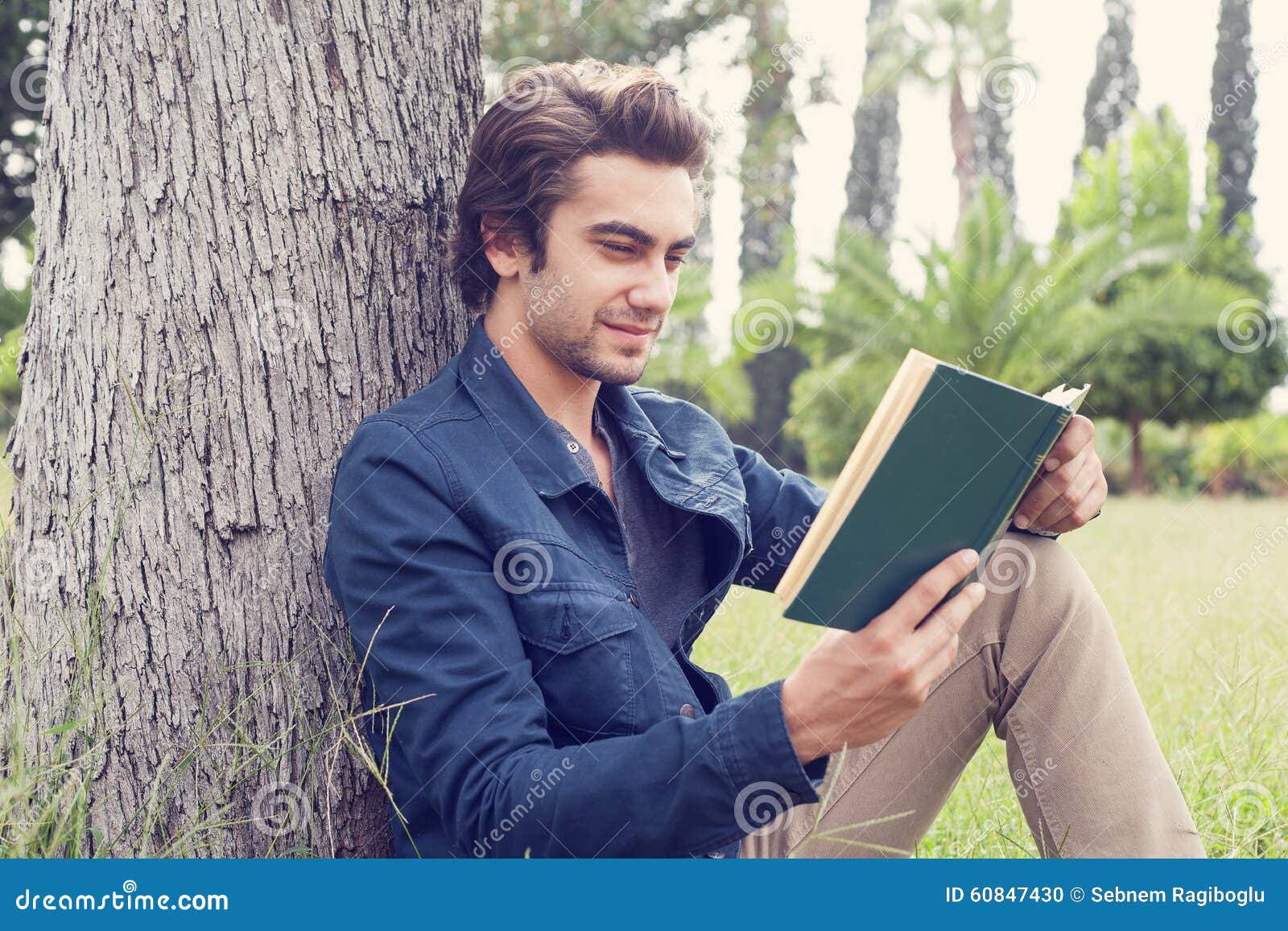 Young Man Reading Book in Park Stock Photo - Image of teen, university ...