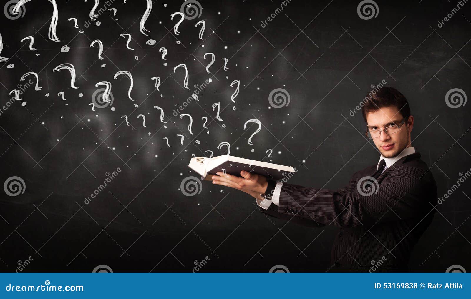Young Man Reading a Book with Question Marks Coming Out from it Stock ...