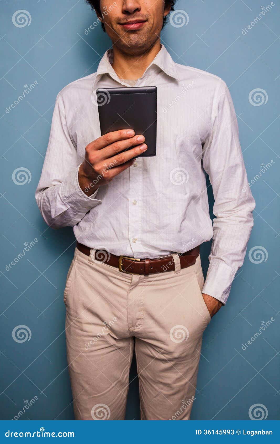 Young Man Reading on a Digital Tablet Stock Image - Image of ...