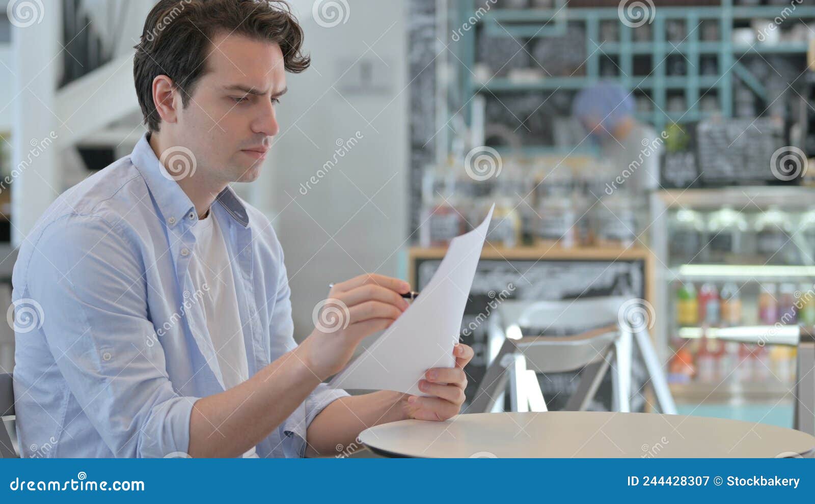 Creative Man Reading Documents in Cafe Stock Image - Image of white ...