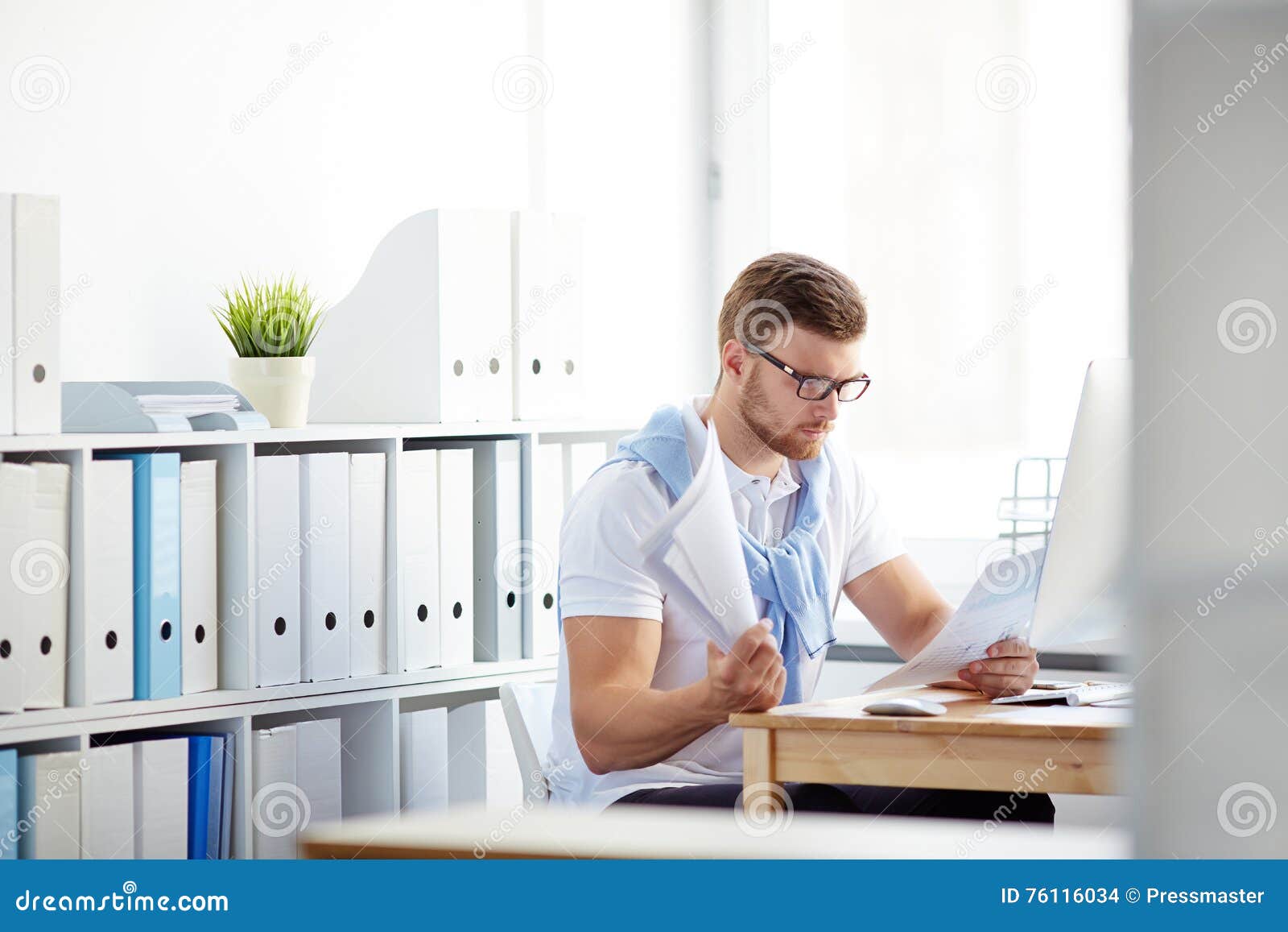 Young Man Reading Documents Stock Photo - Image of businessman ...