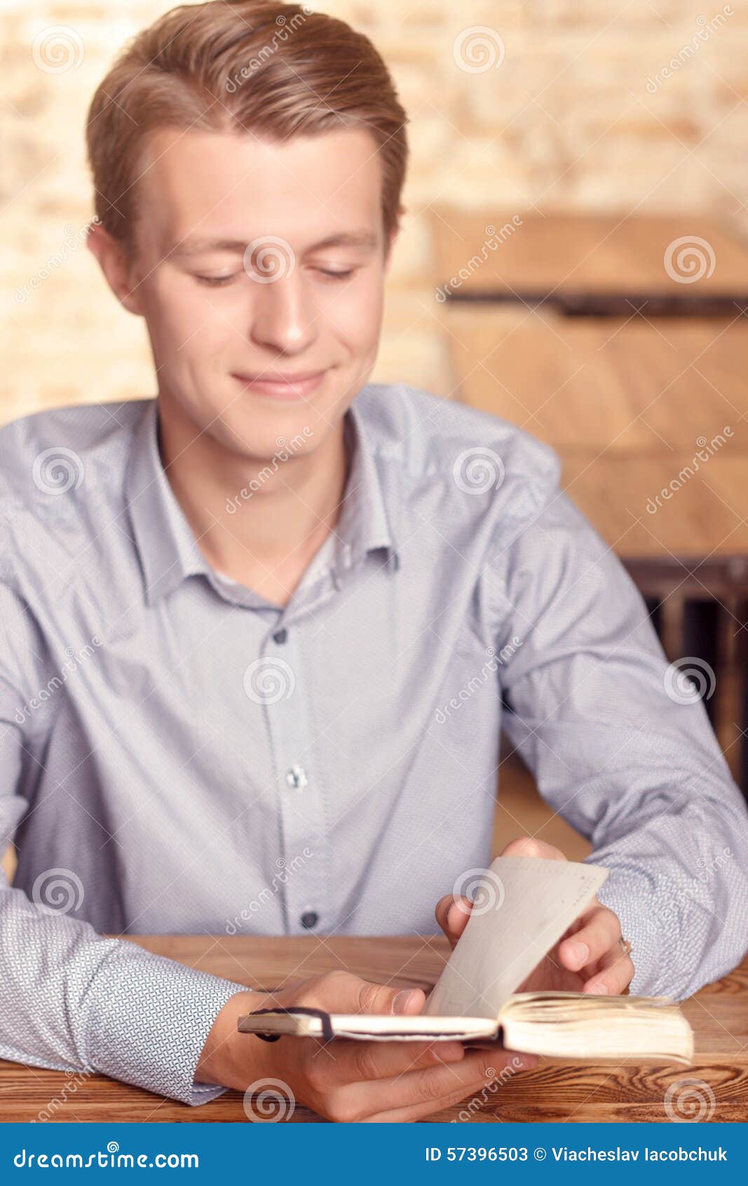 Young Man Reading His Notes in Cafe Stock Image - Image of poem, book ...