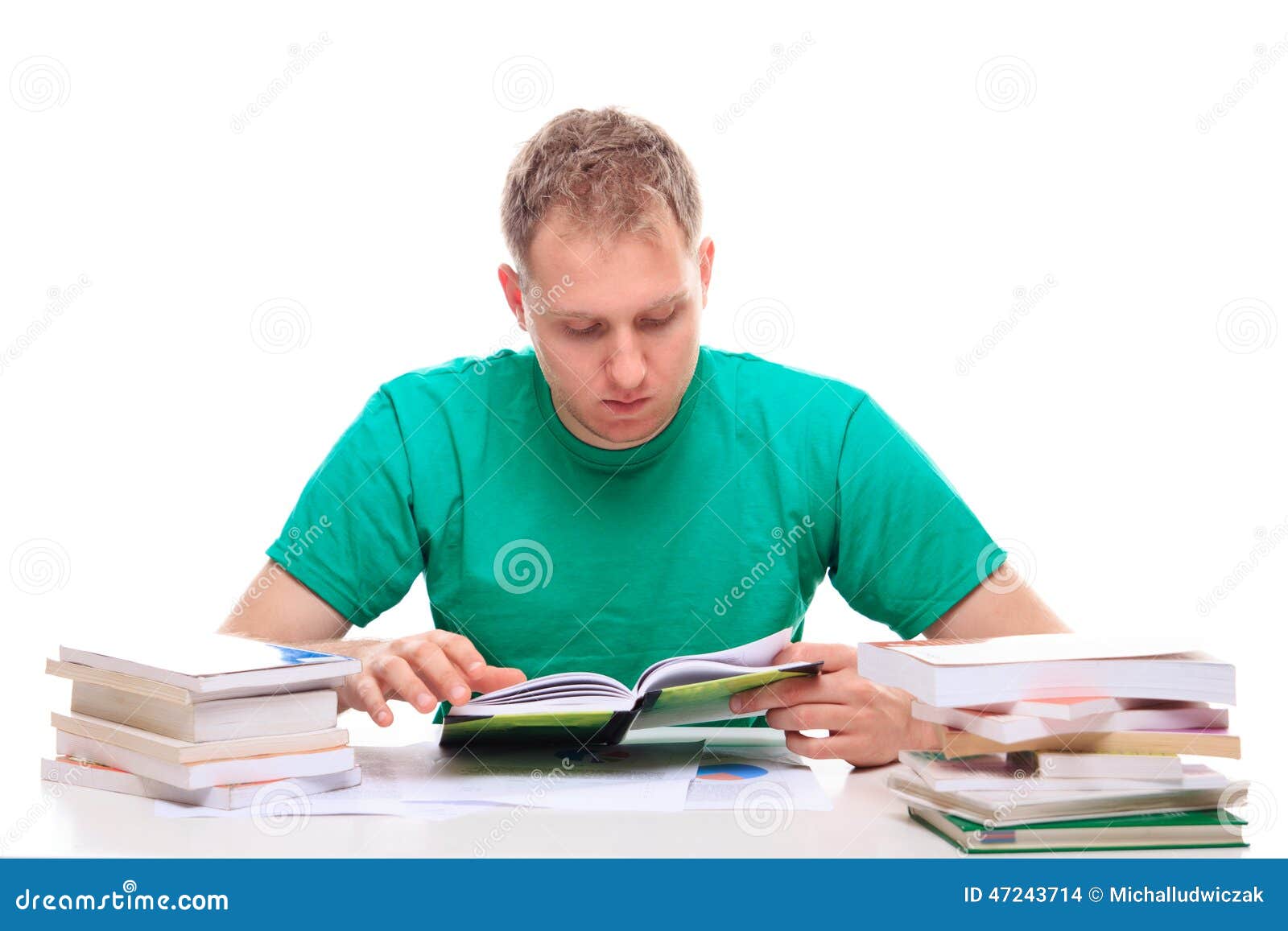 Young Man Reading Literature at the Desk Stock Photo - Image of desk ...