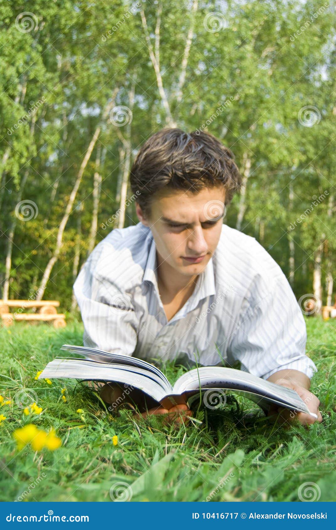 Young Man Reading a Magazine in the Park Stock Image - Image of nature ...