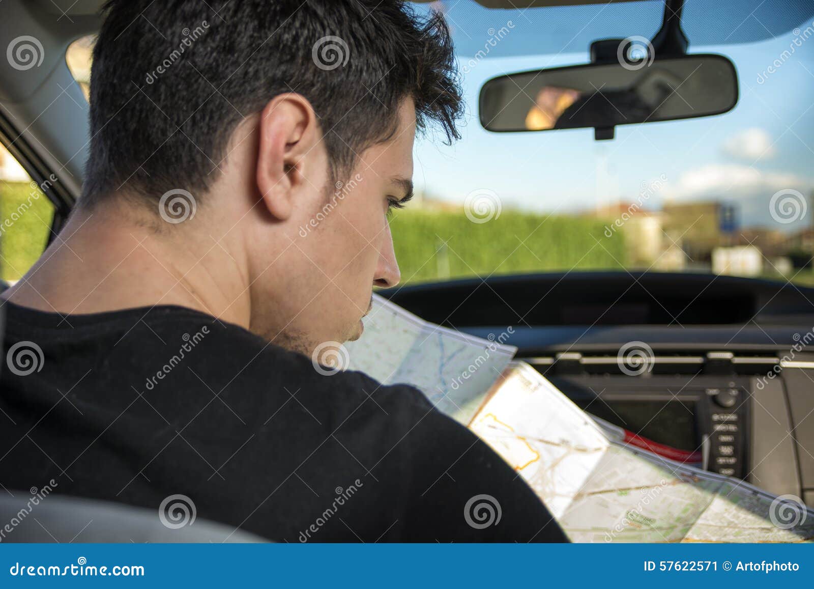 Young Man Reading Map Inside of a Car Stock Image - Image of handsome ...
