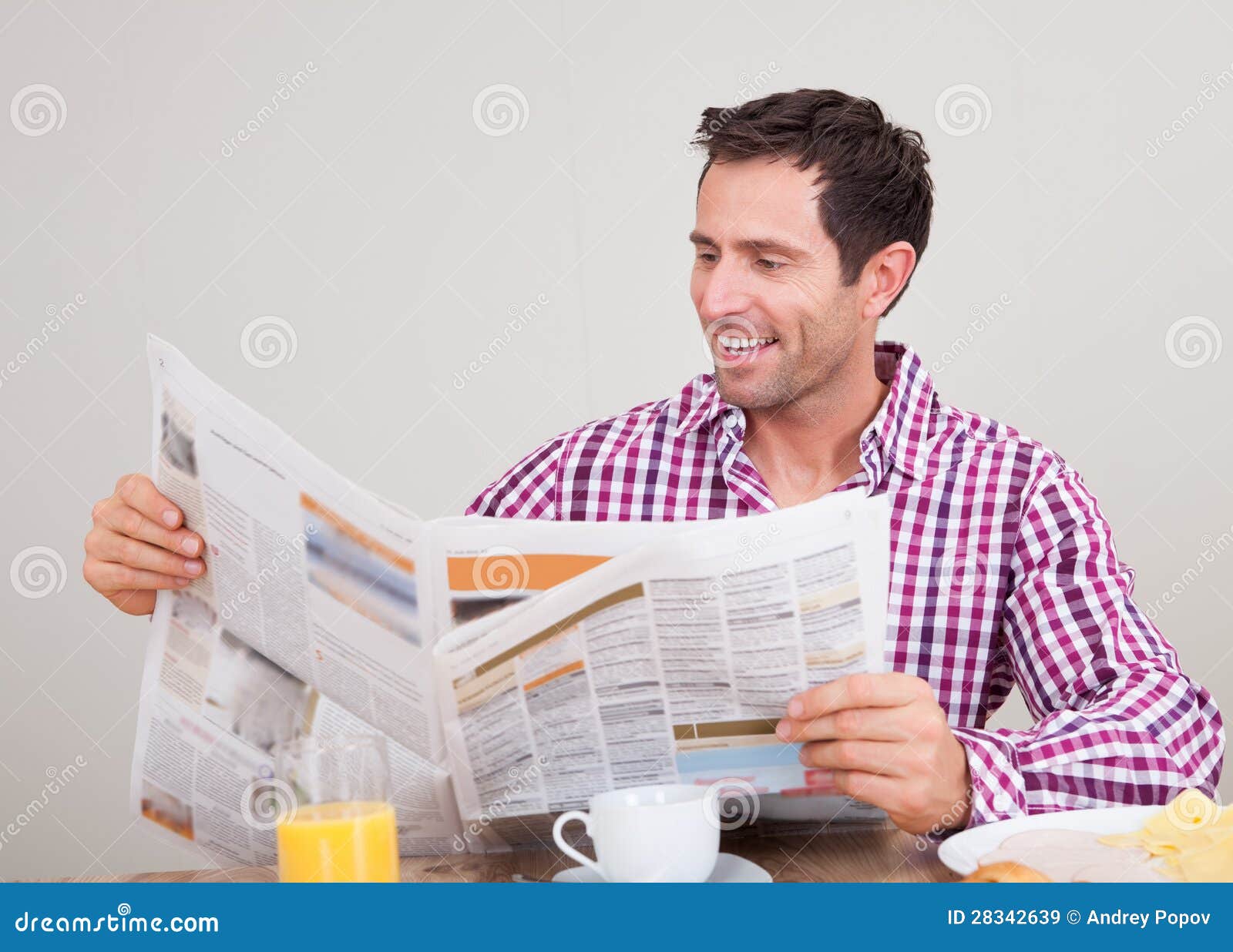 Young Man Reading Newspaper at Breakfast Stock Image - Image of home ...