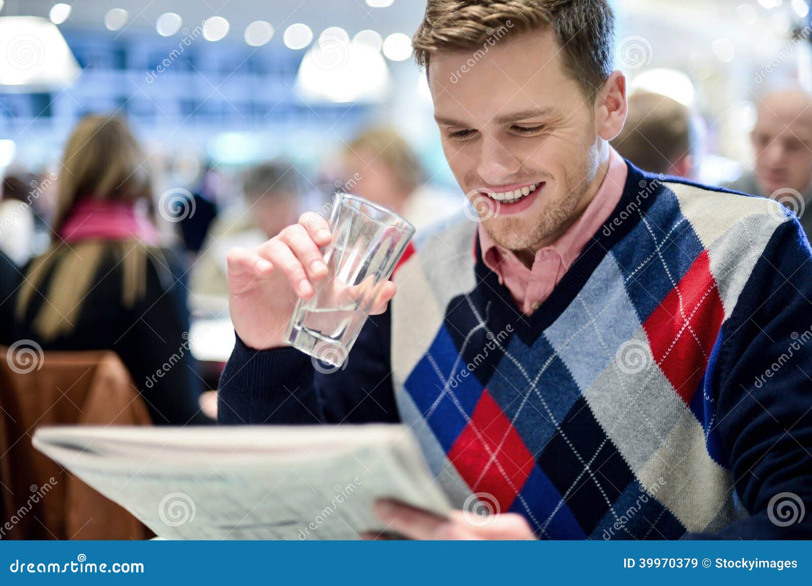 Young Man Reading Newspaper at Cafe Stock Image - Image of joyful, cafe ...