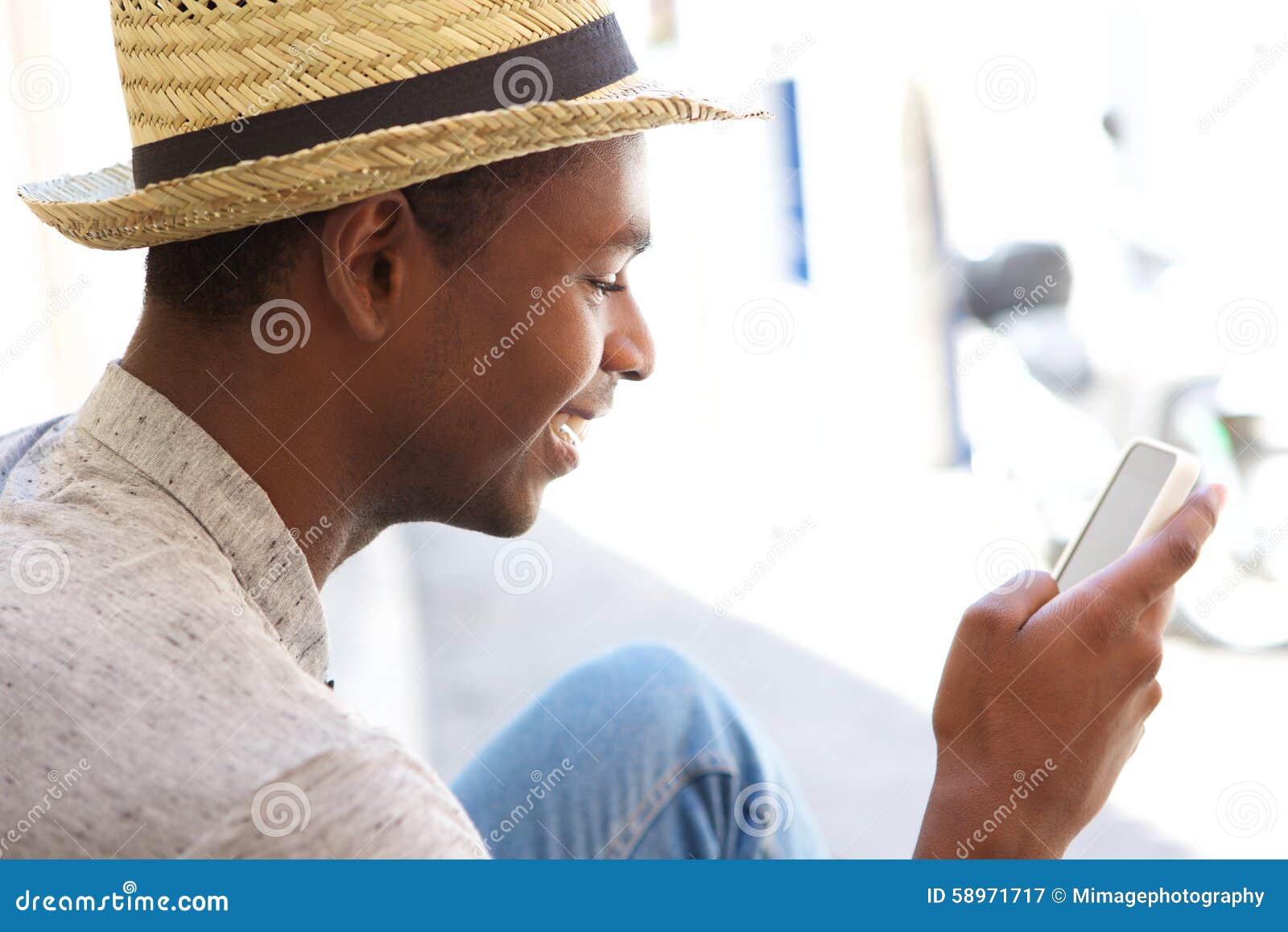 Young Man Reading Text Message on Cell Phone Stock Image - Image of ...