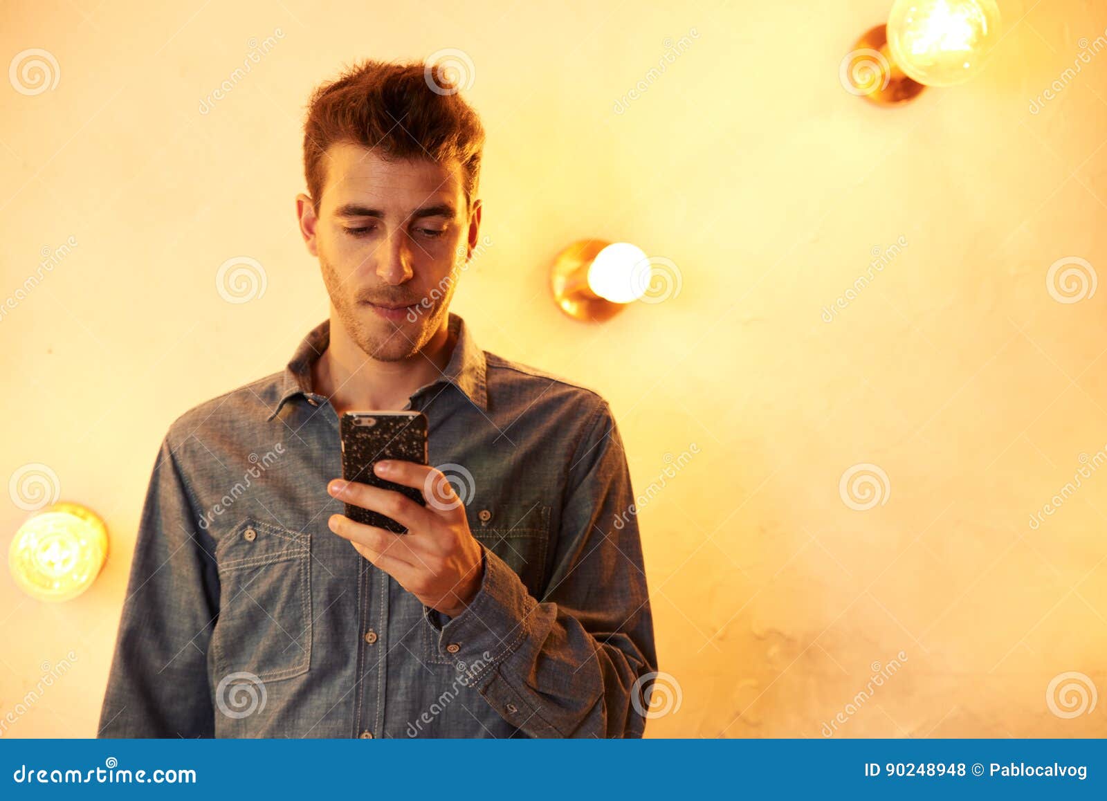 Young Man Reading a Text Message Stock Photo - Image of casual, bulbs ...