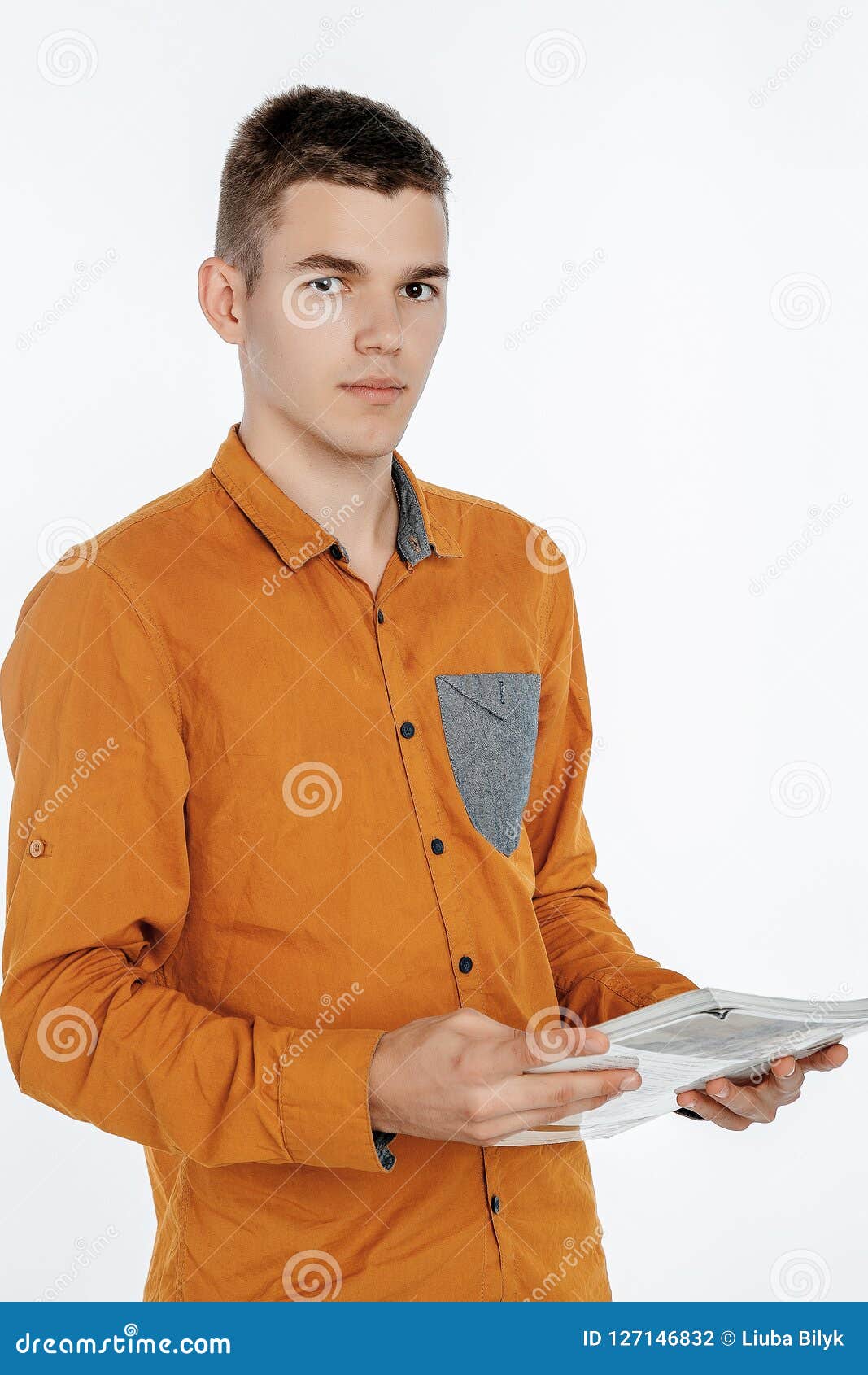 A Young Man Reads a Book. the Guy is Browsing the Magazine. Reading ...