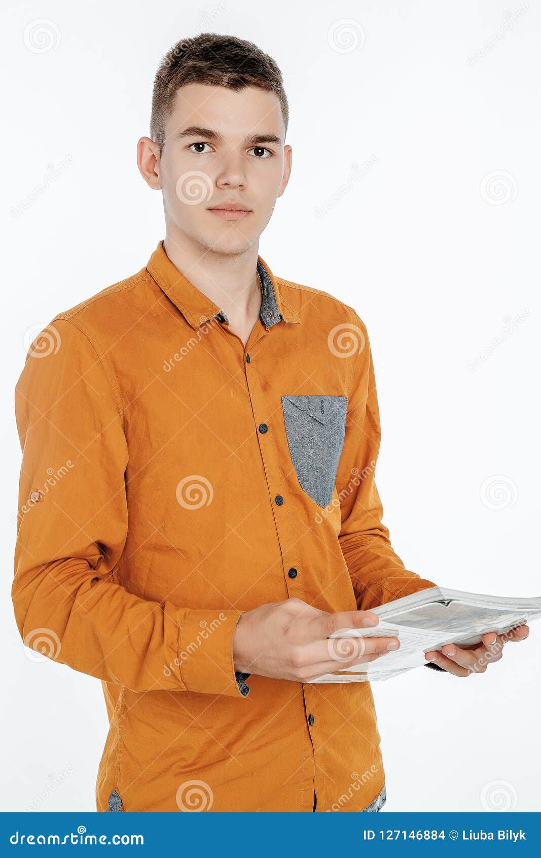 A Young Man Reads a Book. the Guy is Browsing the Magazine. Reading ...