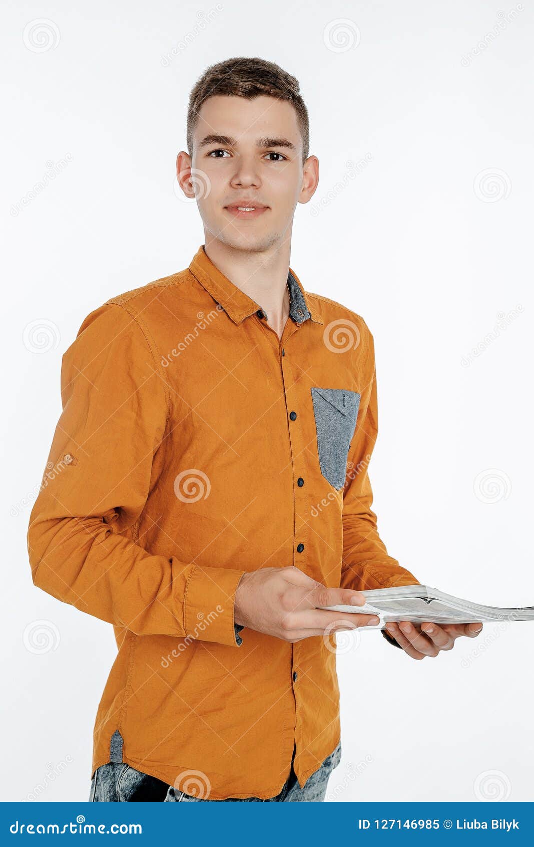 A Young Man Reads a Book. the Guy is Browsing the Magazine. Reading ...
