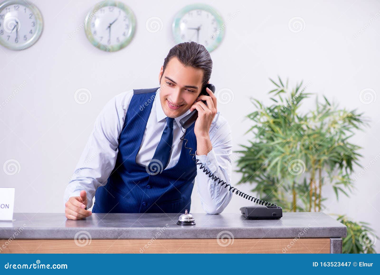 Young Man Receptionist at the Hotel Counter Stock Image - Image of ...
