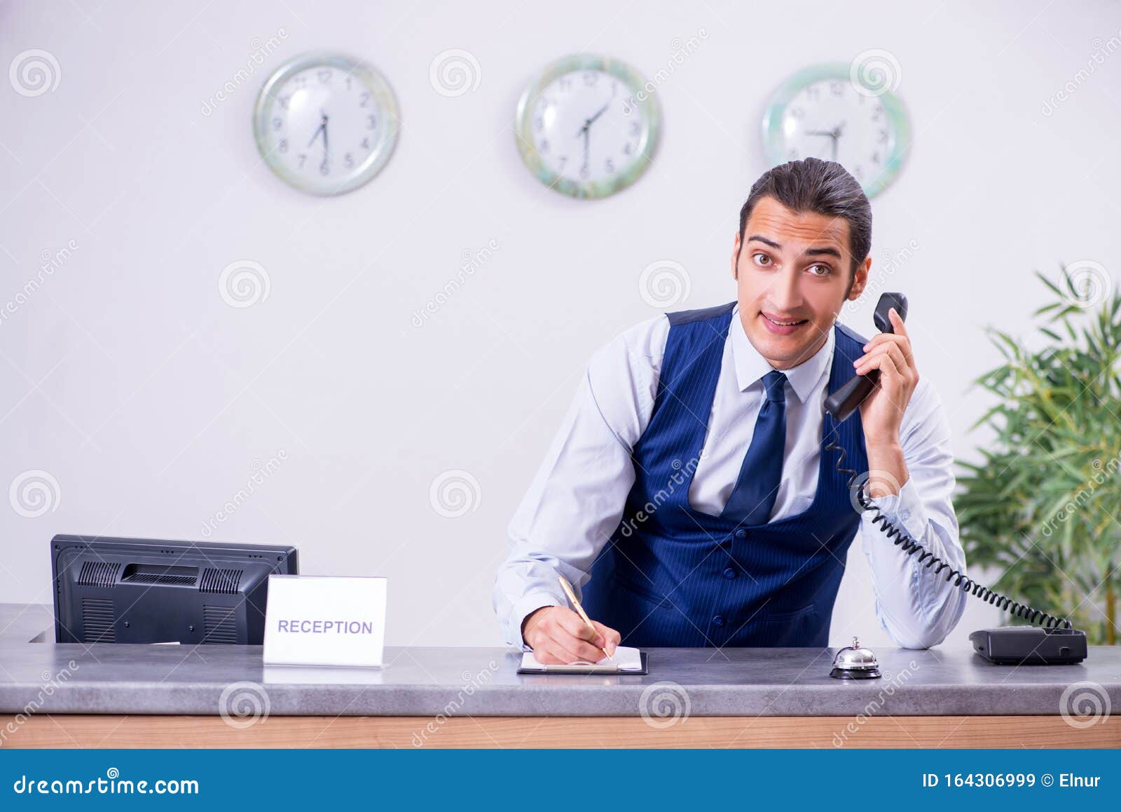 Young Man Receptionist at the Hotel Counter Stock Image - Image of ...