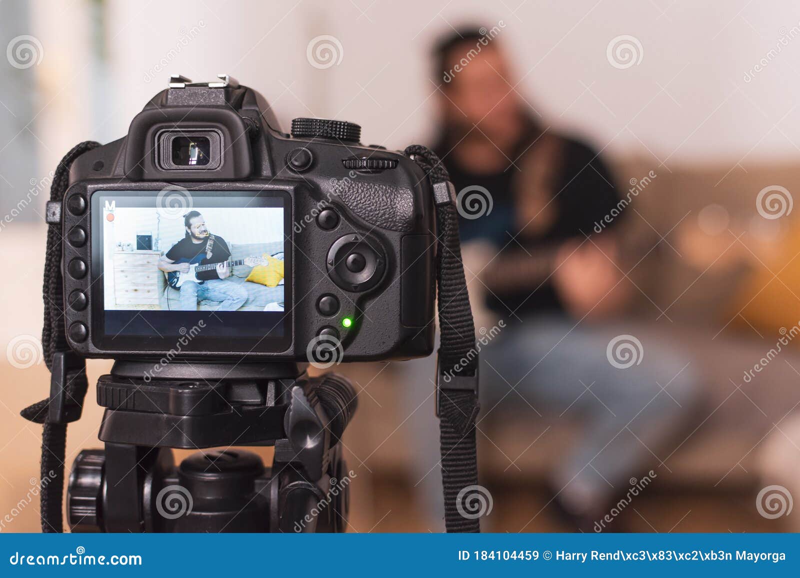 Young Man Recording an Online Guitar Lesson Video Tutorial at Home ...