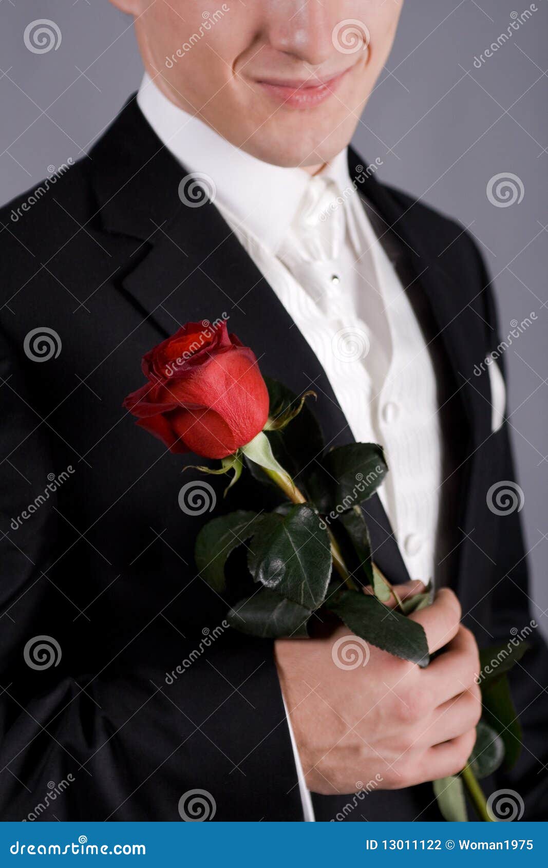 Young man with a red rose stock photo. Image of flower - 13011122