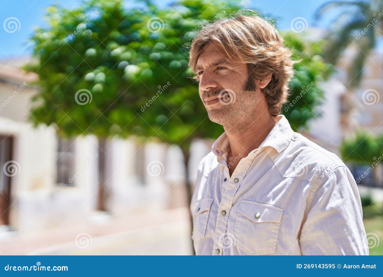 Young Man with Relaxed Expression Standing at Park Stock Image - Image ...