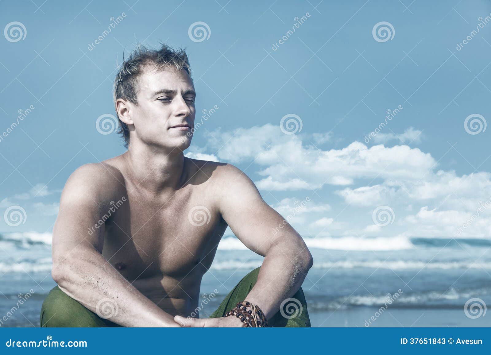 Young Man Relaxing on Beach Stock Image - Image of nature, person: 37651843