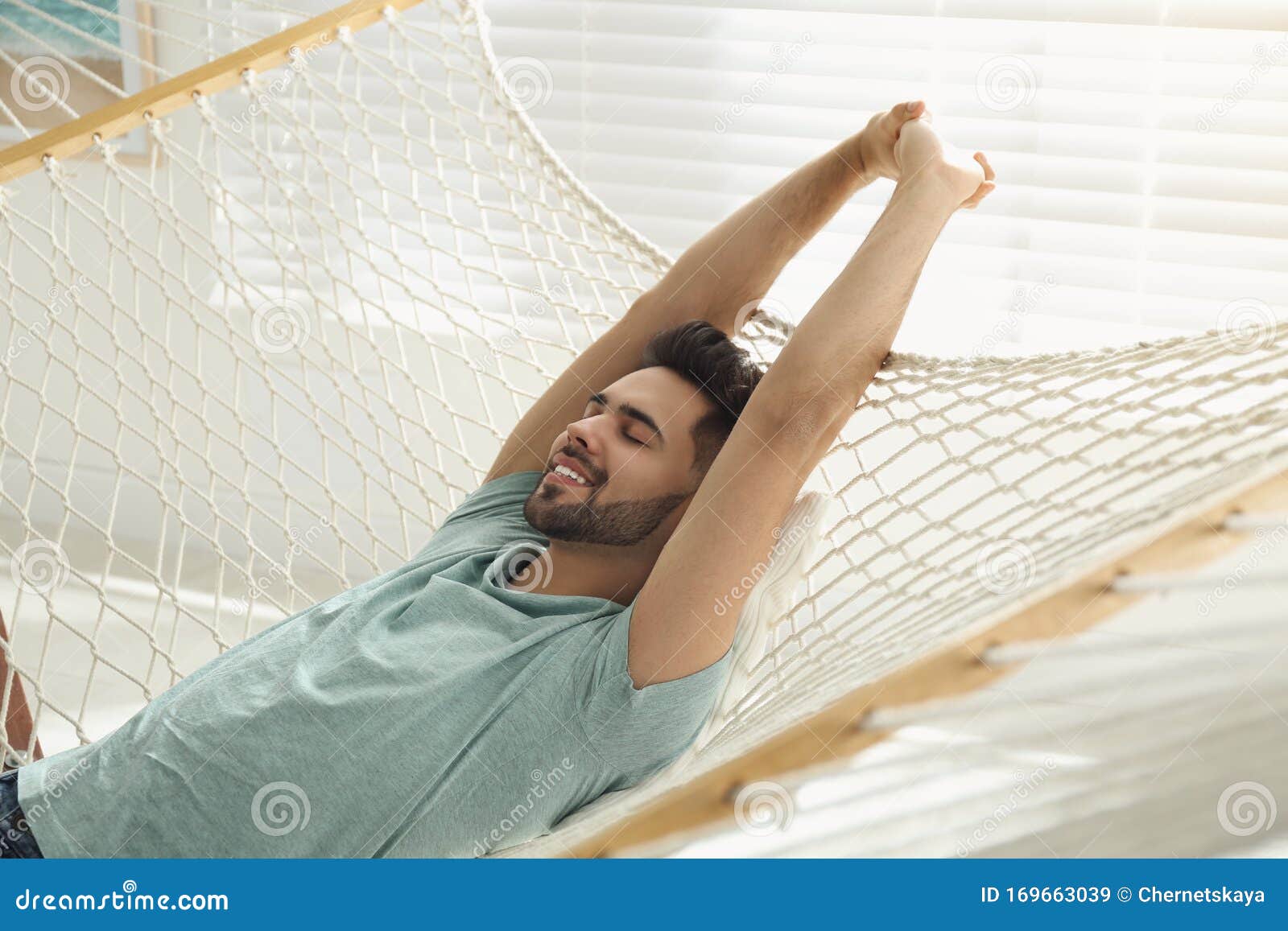 Young Man Relaxing in Hammock Stock Image - Image of lounge, indoors ...