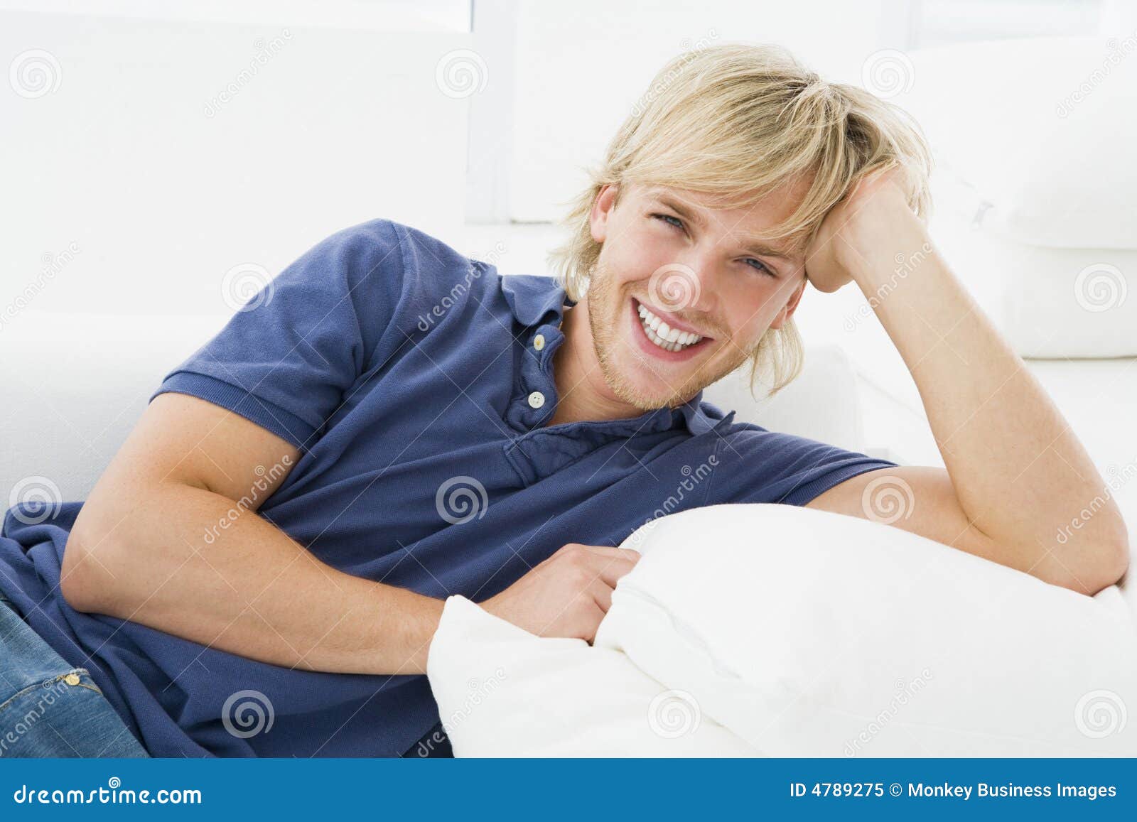 Young man relaxing at home stock image. Image of years - 4789275