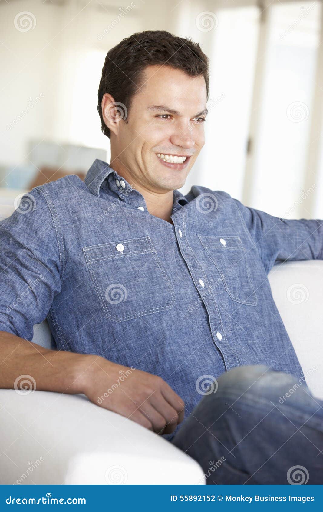 Young Man Relaxing at Home stock photo. Image of happiness - 55892152