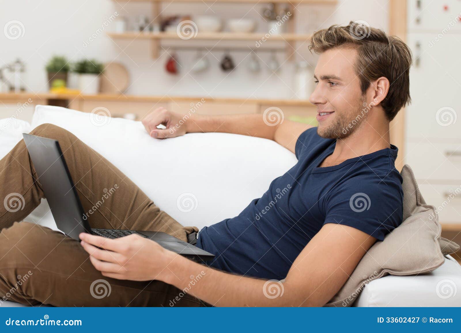 Young Man Relaxing with a Laptop Computer Stock Image - Image of ...