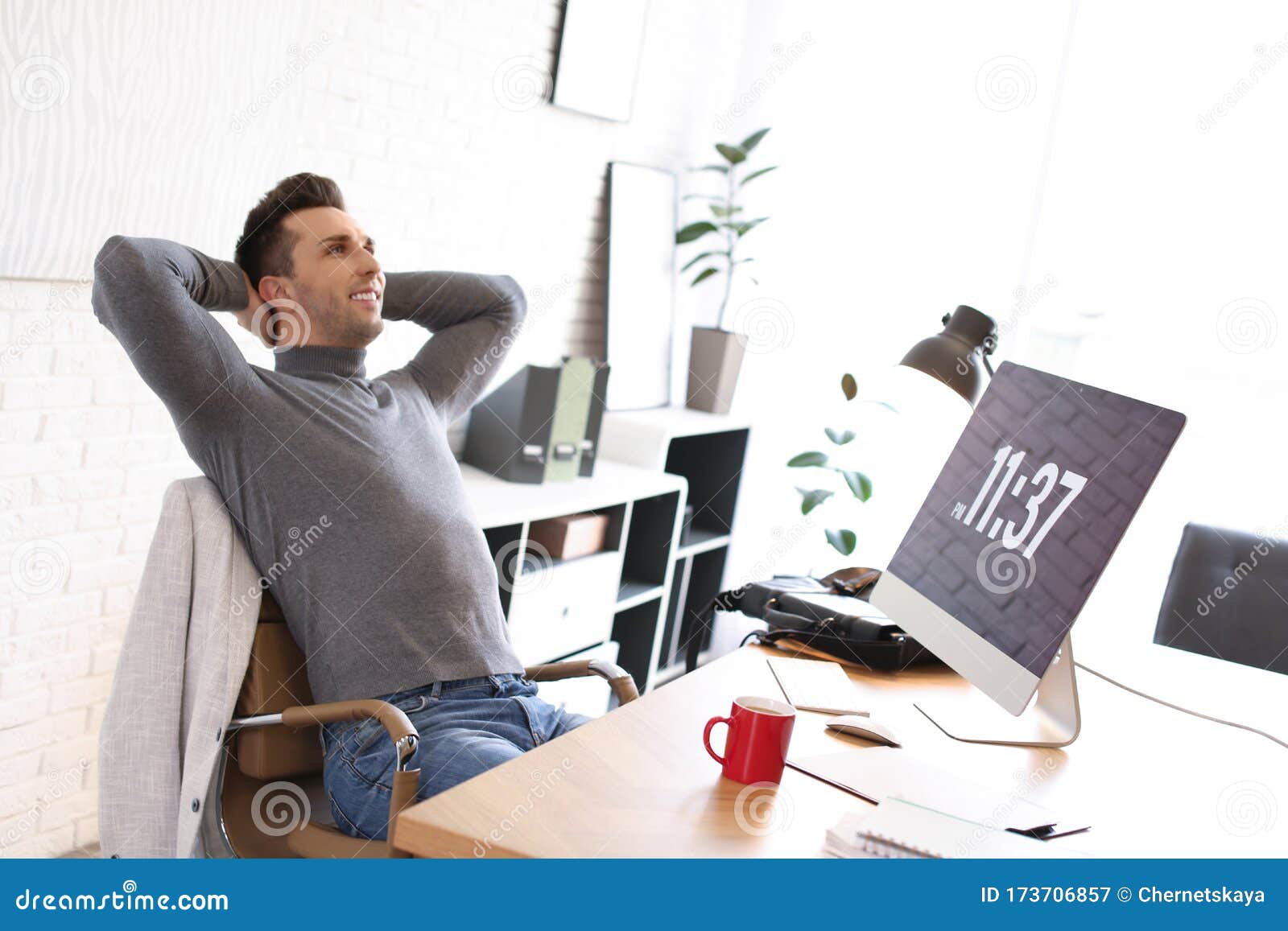 Young Man Relaxing in Office during Break Stock Image - Image of ...
