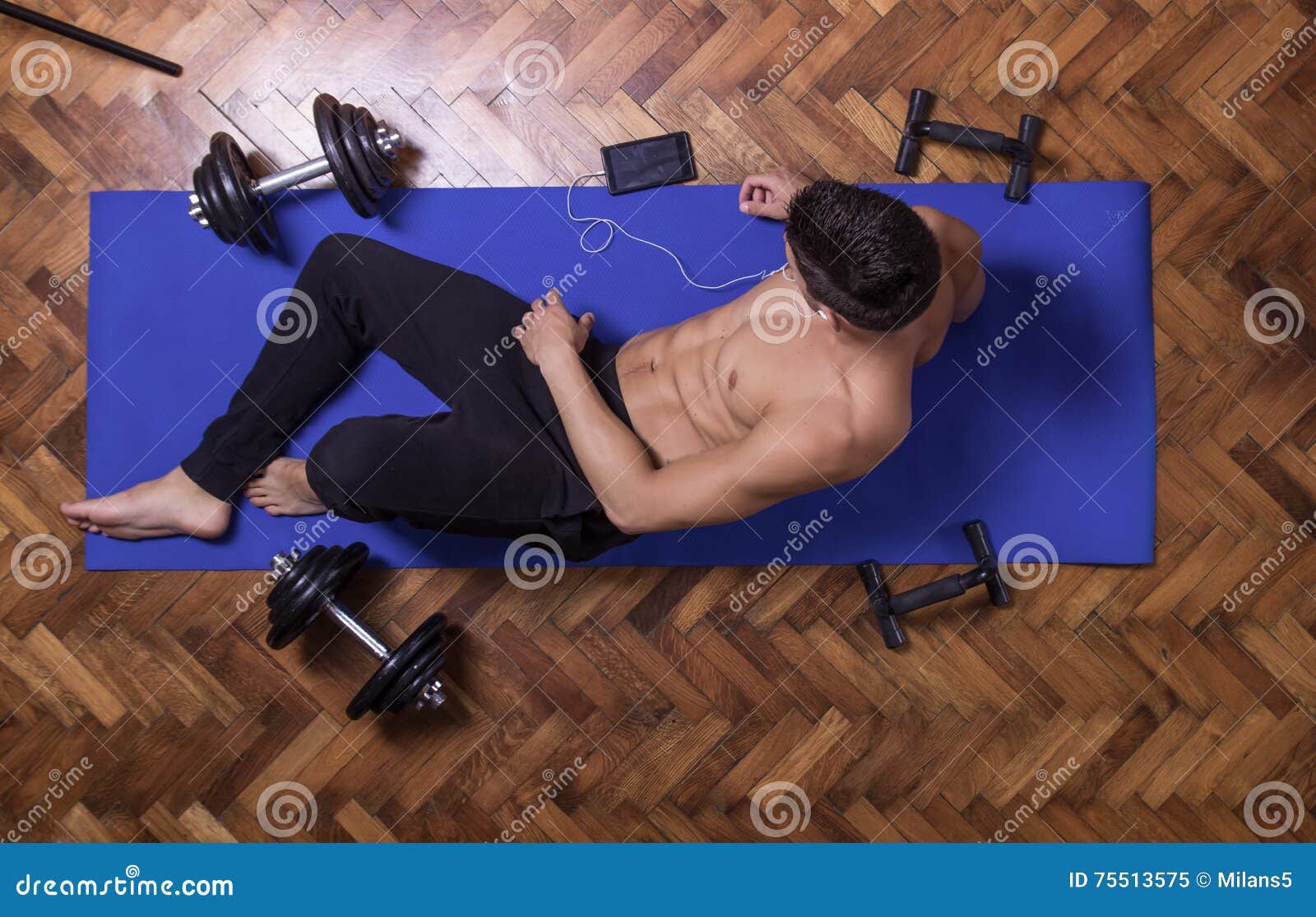 Young Man Relaxing Smartphone Elevated View Exercise Mat Stock Image ...
