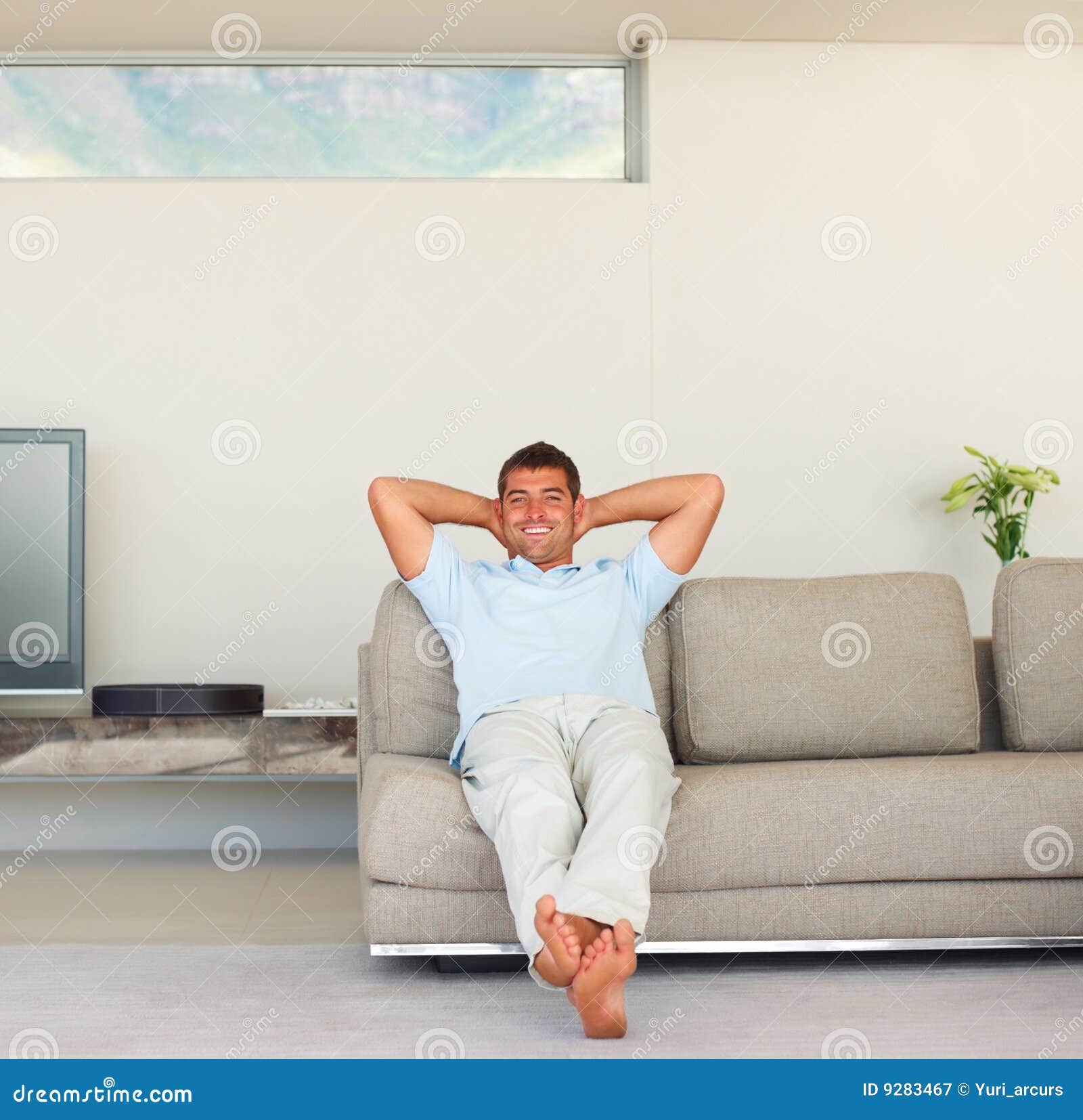 Young Man Relaxing on a Sofa Stock Image - Image of isolate, people ...