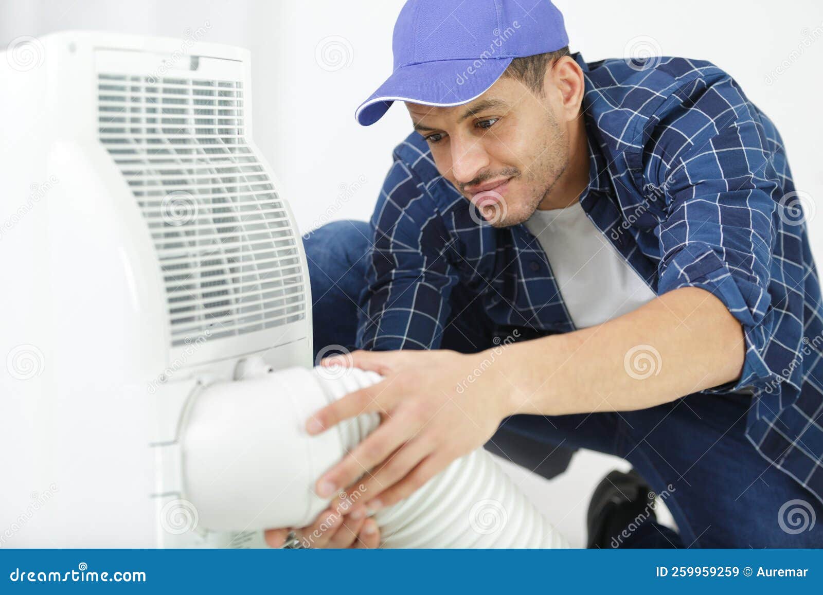 Young Man Repairing Air Conditioner Standing on Stepladder Stock Image ...