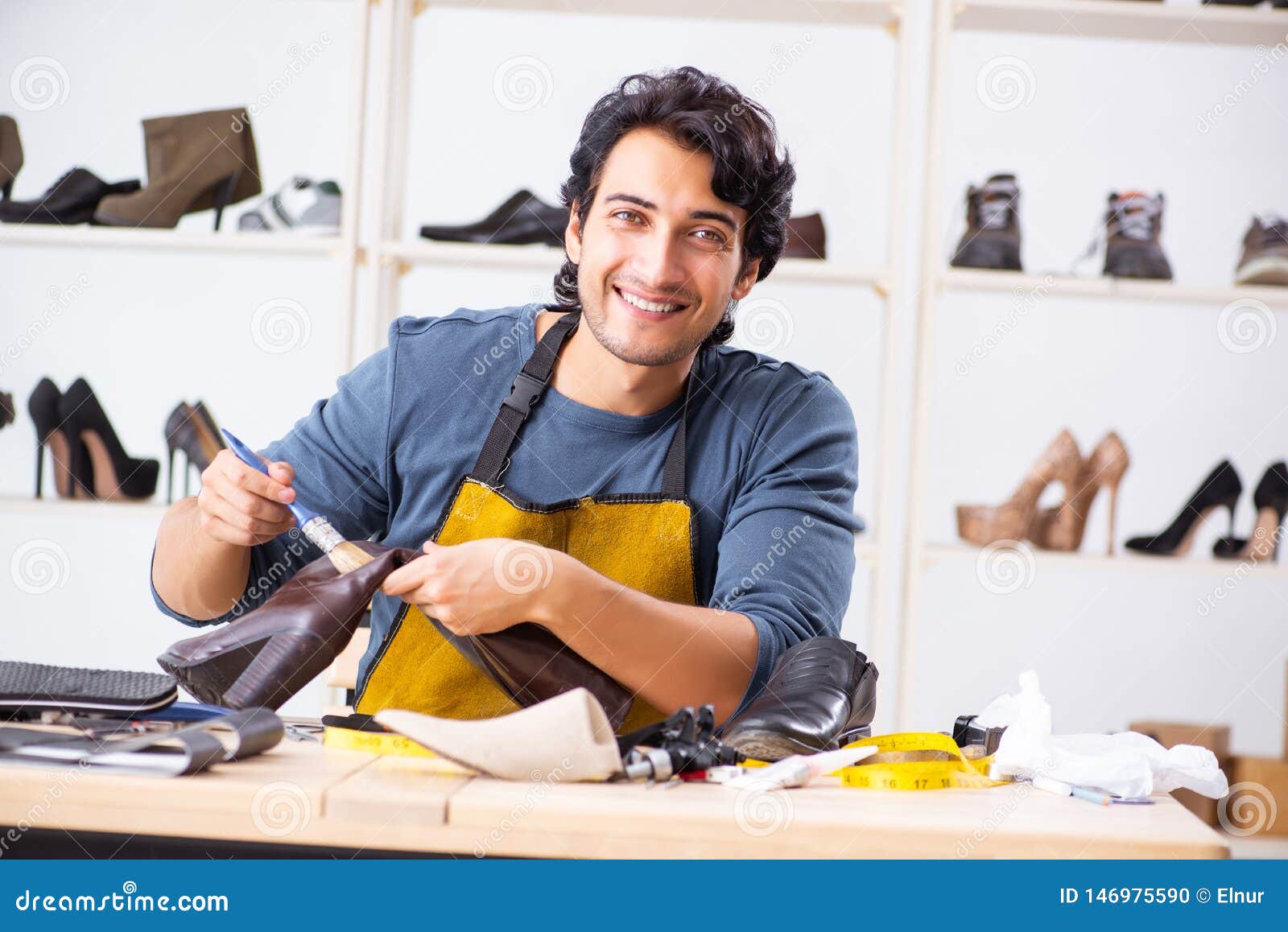 The Young Man Repairing Shoes in Workshop Stock Photo - Image of ...
