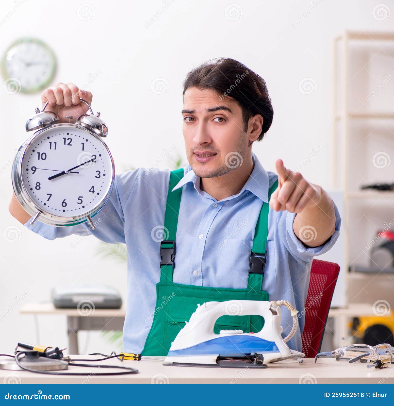 Young Man Repairman in Time Mannagement Concept Stock Photo - Image of ...