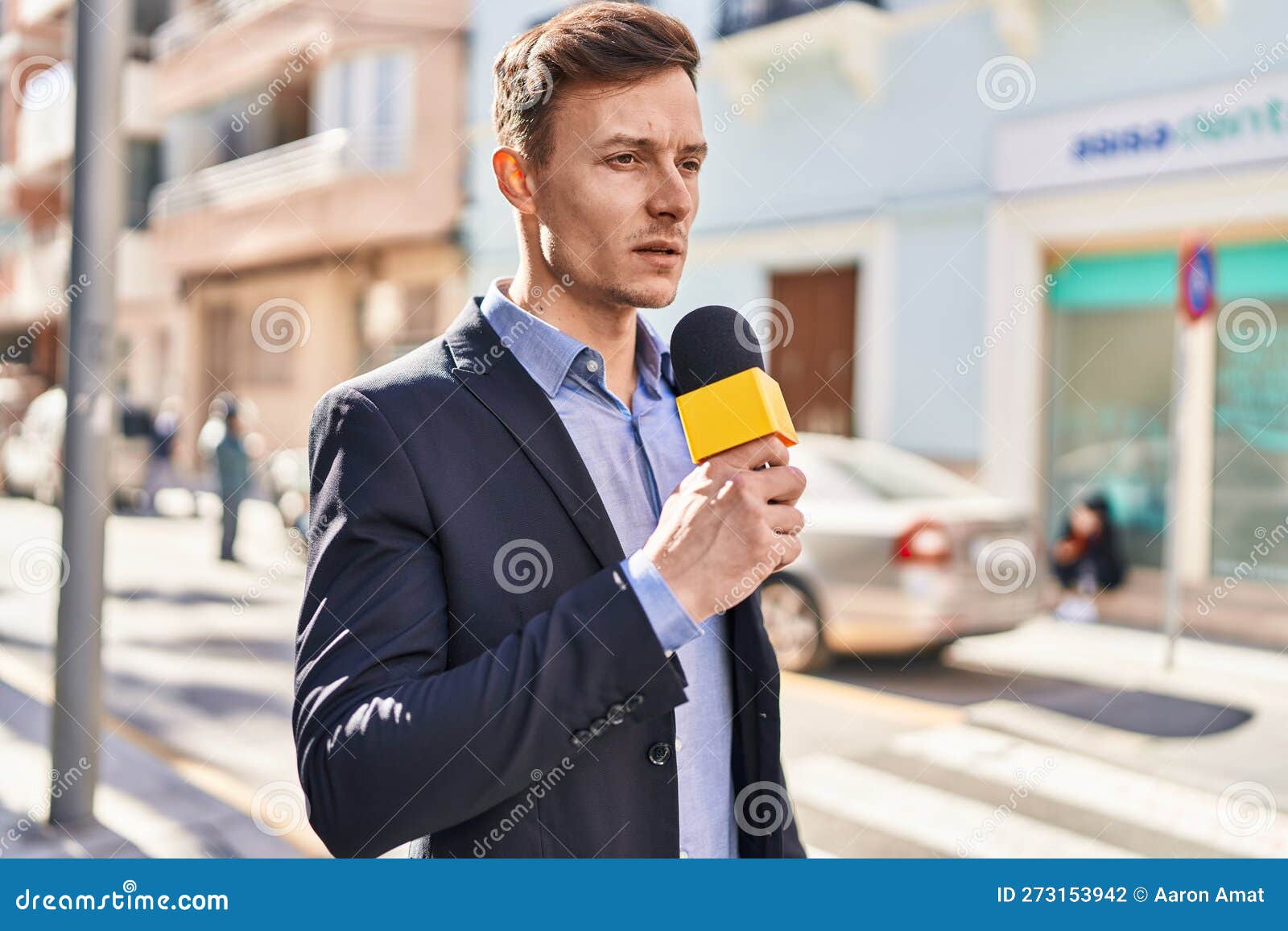 Young Man Reporter Working Using Microphone at Street Stock Photo ...
