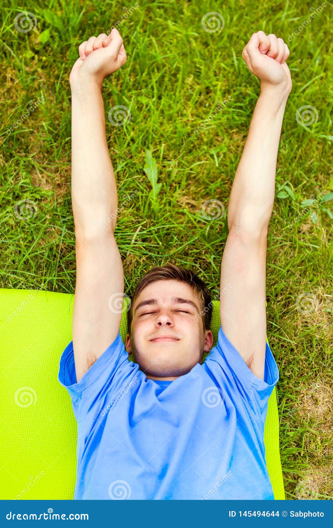 Young Man Rest on the Grass Stock Photo - Image of relaxation, quiet ...