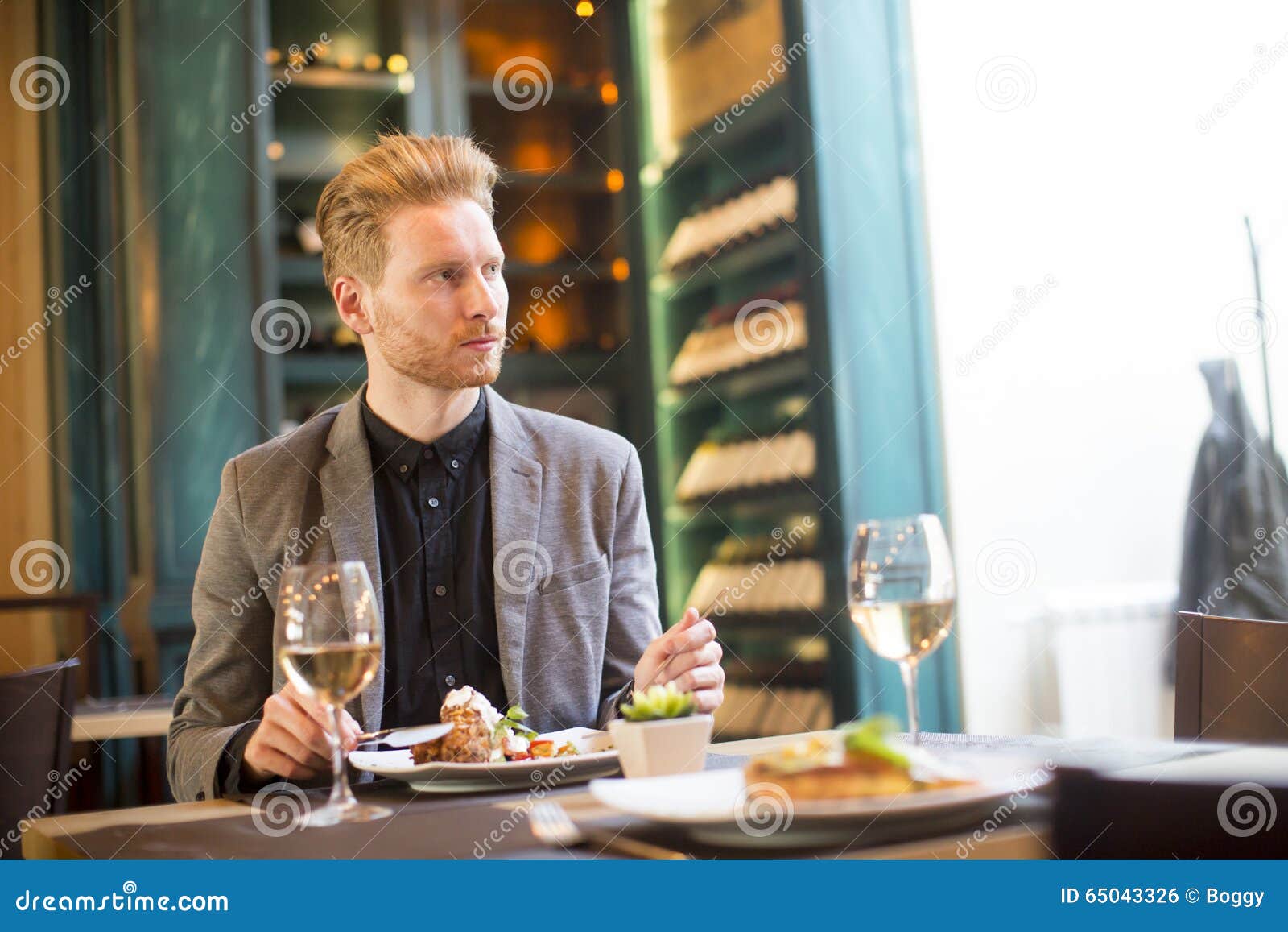 Young Man at the Restaurant Stock Photo - Image of lunch, food: 65043326