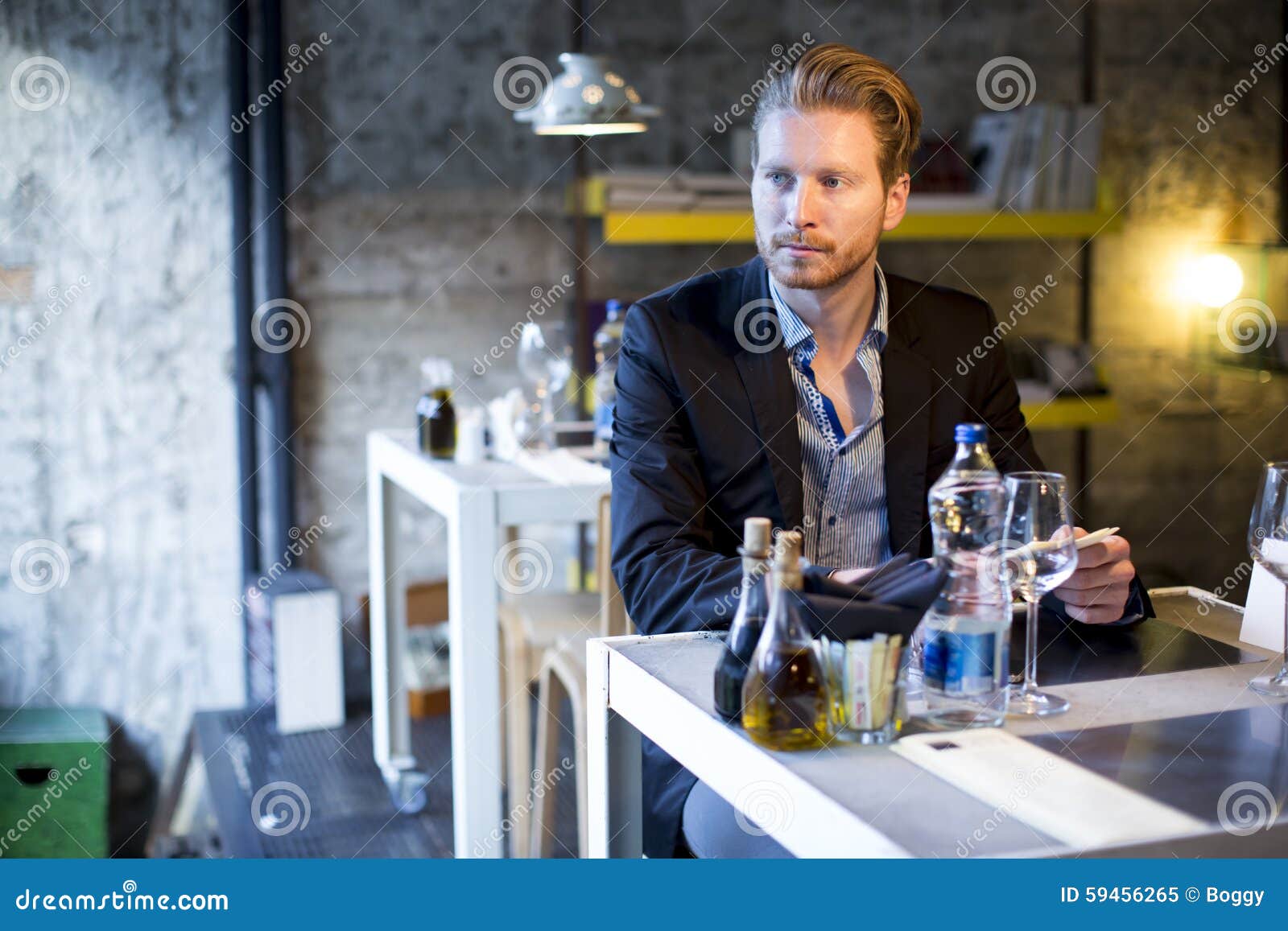 Young Man in the Restaurant Stock Image - Image of menu, attractive ...