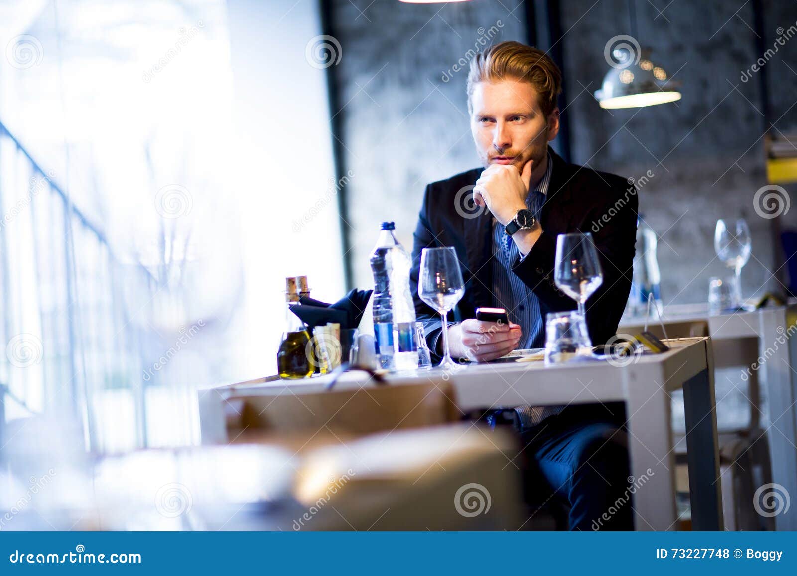 Young man in restaurant stock photo. Image of caucasian - 73227748