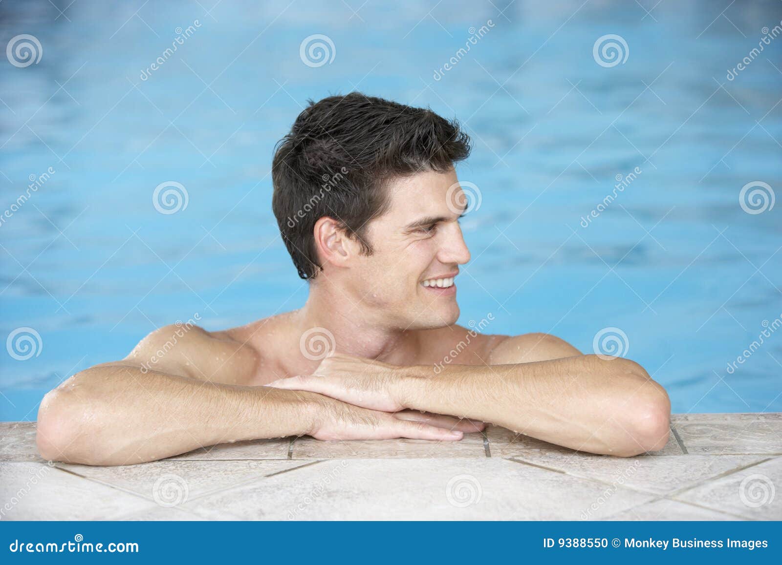 Young Man Resting on Edge of Swimming Pool Stock Photo - Image of ...